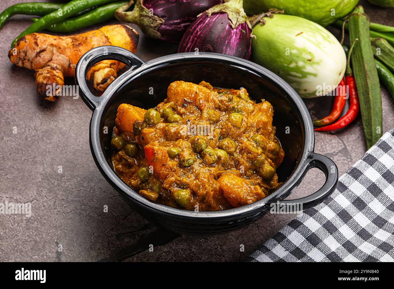 Indian traditional cuisine Aloo mutter - potato with green peas Stock ...