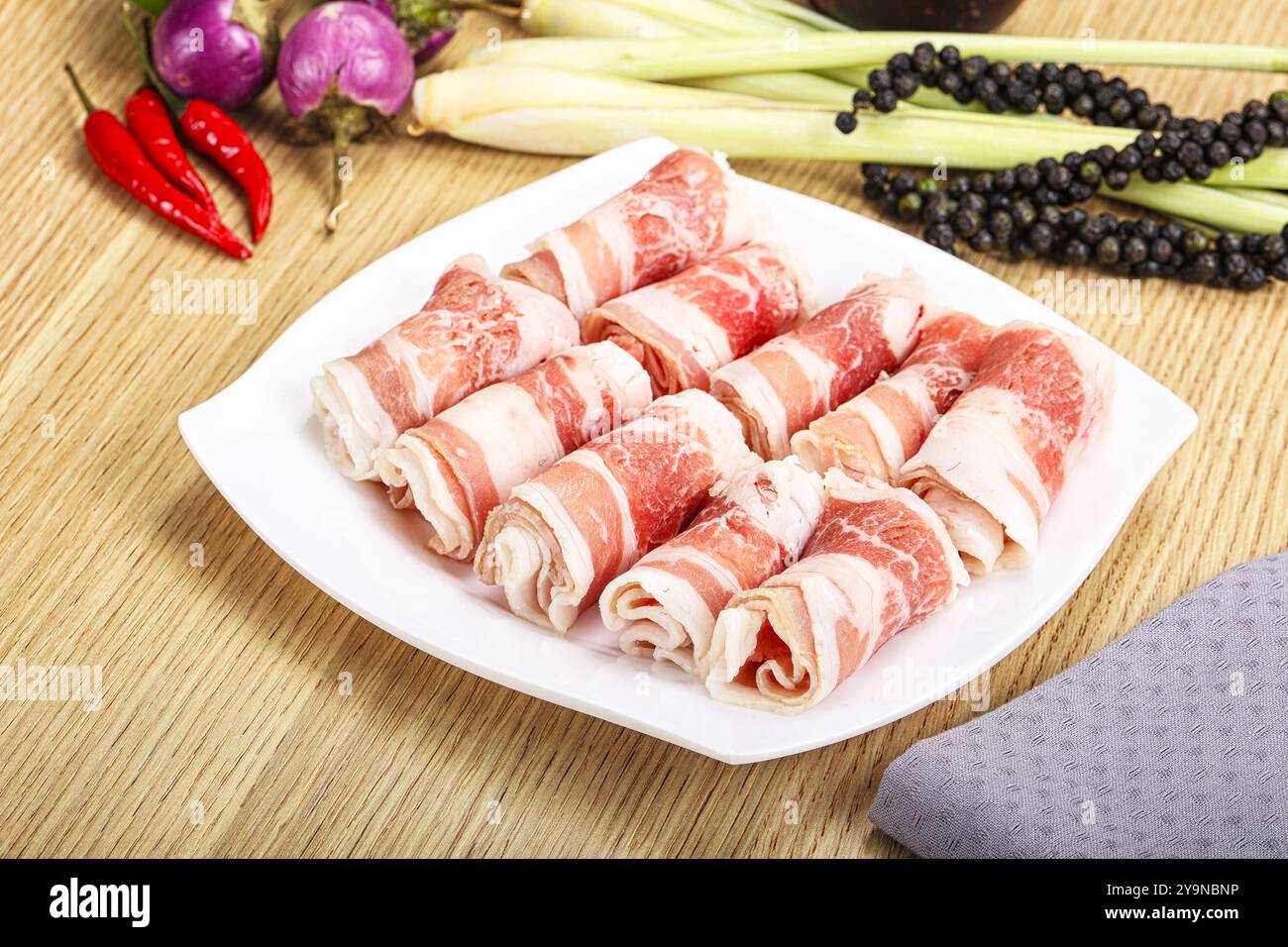 Raw beef bacon roll for grill Stock Photo - Alamy