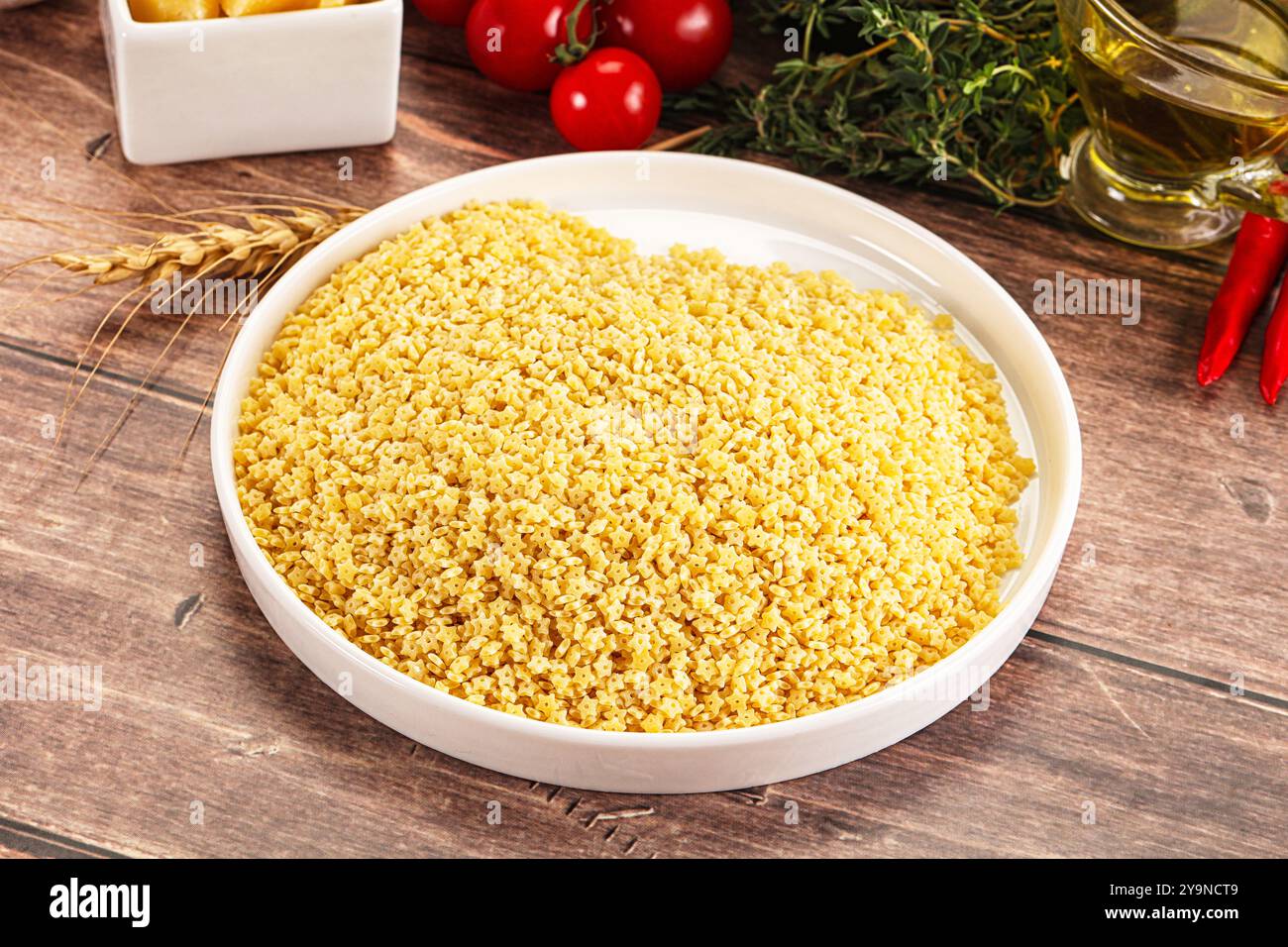 Italian cuisine - dry stelline pasta for bowl Stock Photo - Alamy