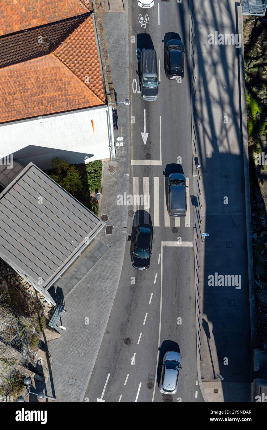 Overhead perspective of traffic and pedestrians at a crosswalk in a ...
