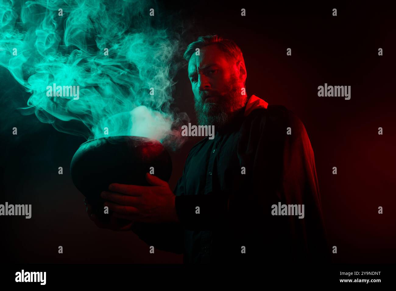 Photo of sorcerer wizard hold cauldron make magic ritual halloween ...