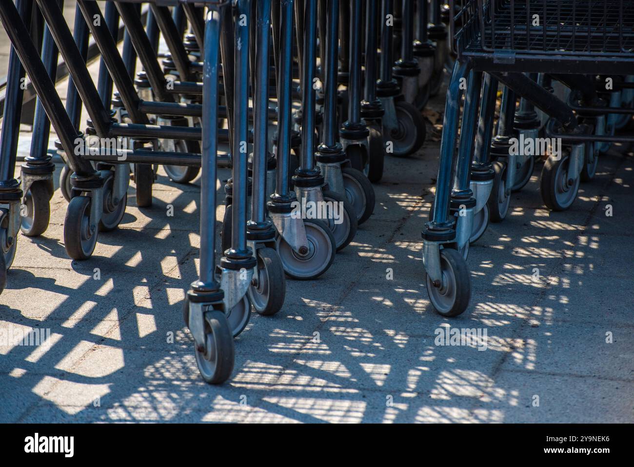 Wheels of shopping trolleys in a stall Stock Photo - Alamy