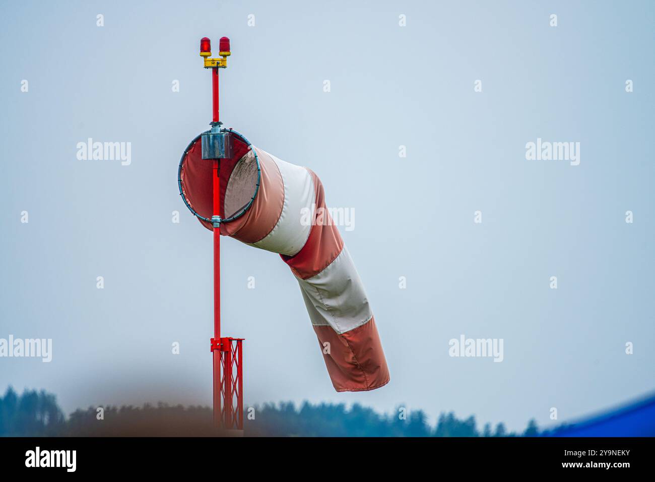 Airport windsock measuring wind speed Stock Photo - Alamy