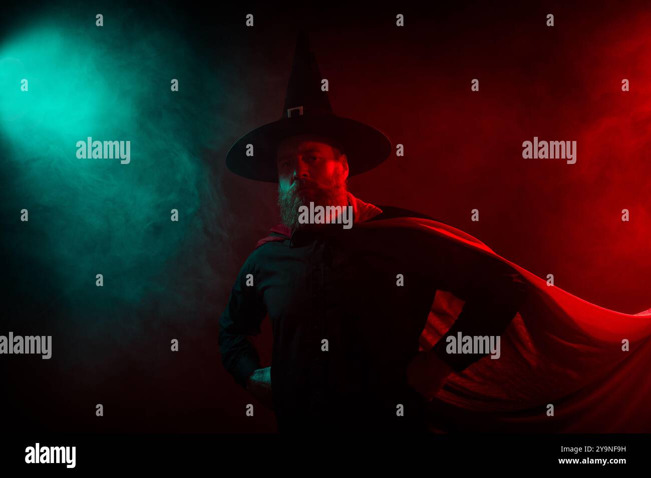 Photo of halloween male character cruel warlock conjuring isolated on ...