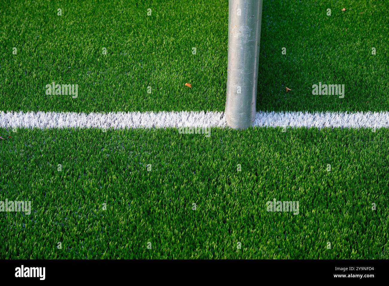 White markings and goal post of an artificial turf football field Stock ...