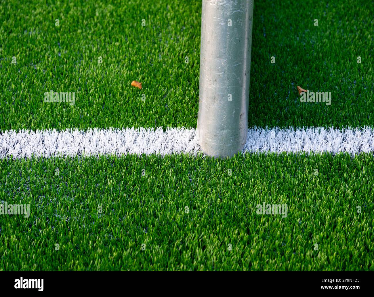 White markings and goal post of an artificial turf football field Stock ...