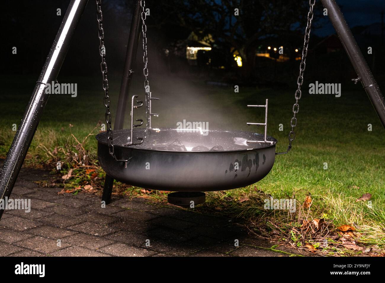 Smoke rising from a hanging fire pit Stock Photo - Alamy