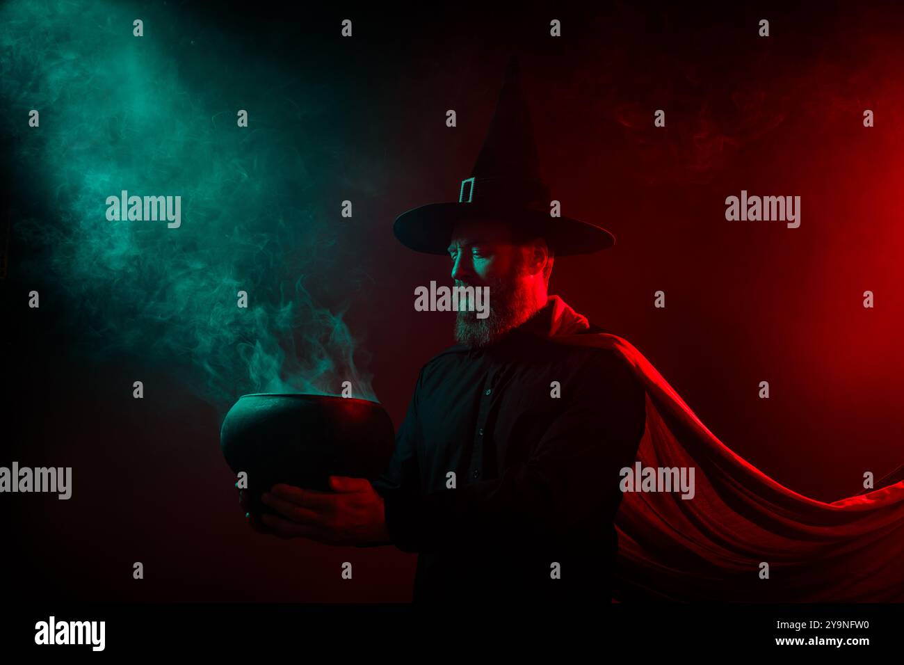 Photo of sorcerer warlock hold cauldron spell magic ritual halloween ...