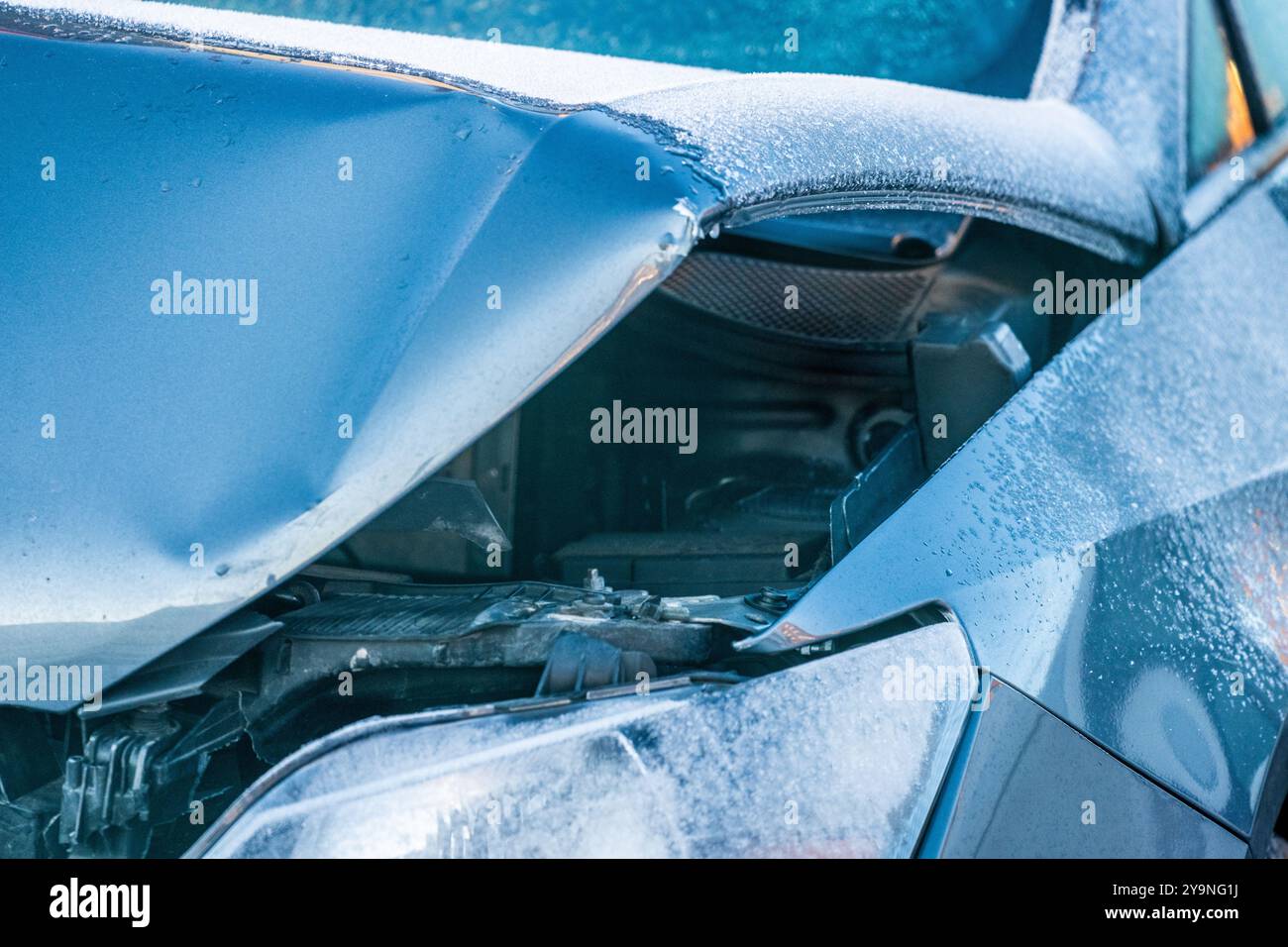Bent and broken hood of a grey car Stock Photo - Alamy