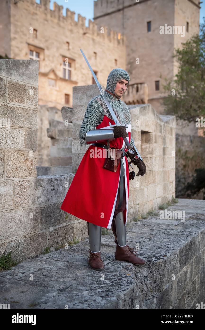 A meember of the Rhodes Medieval Rose Association Knights' Swords Team ...