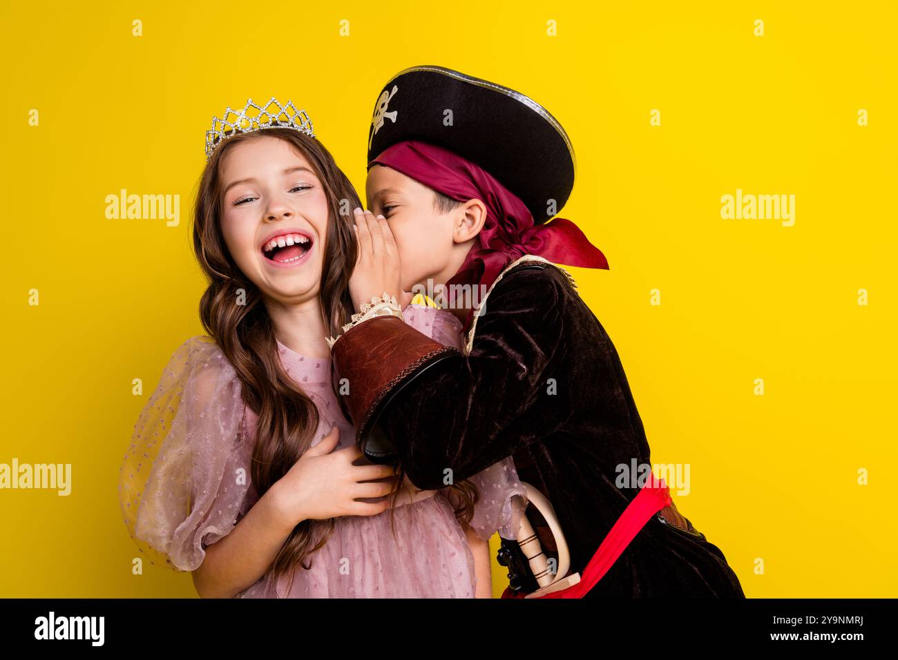 Photo of two little kids whisper ear laugh halloween pirate princess ...