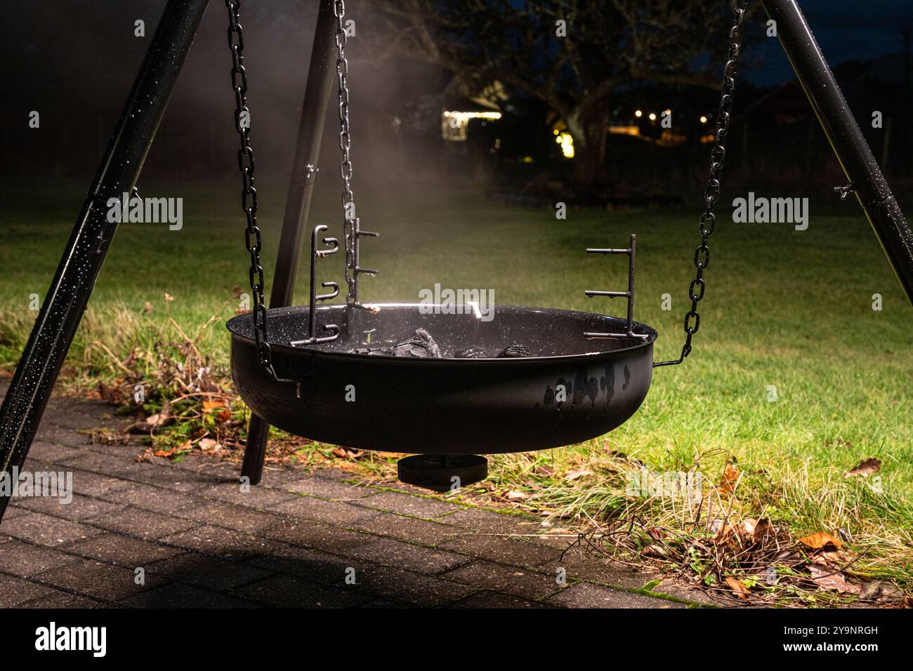 Smoke rising from a hanging fire pit Stock Photo - Alamy