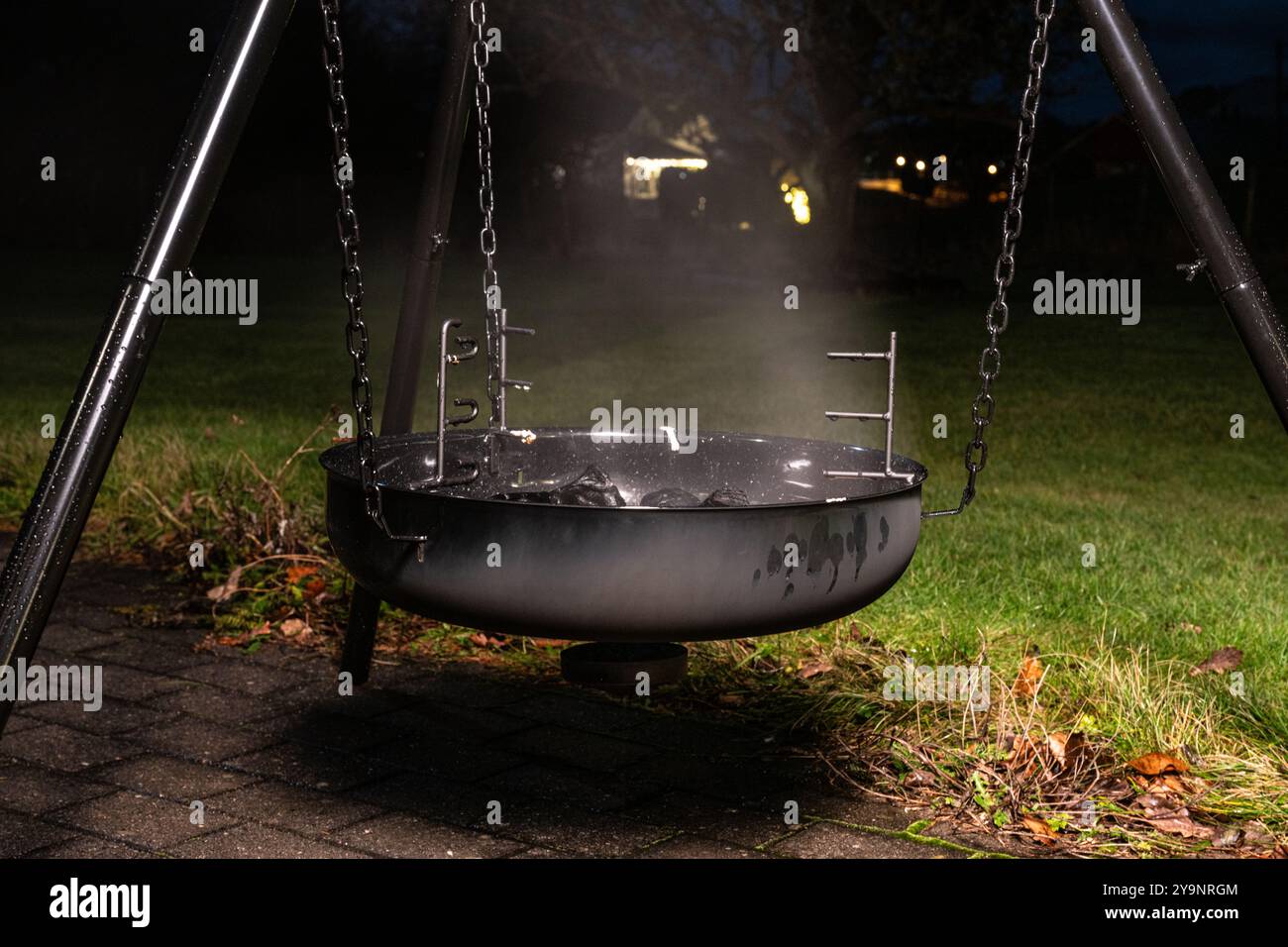 Smoke rising from a hanging fire pit Stock Photo - Alamy
