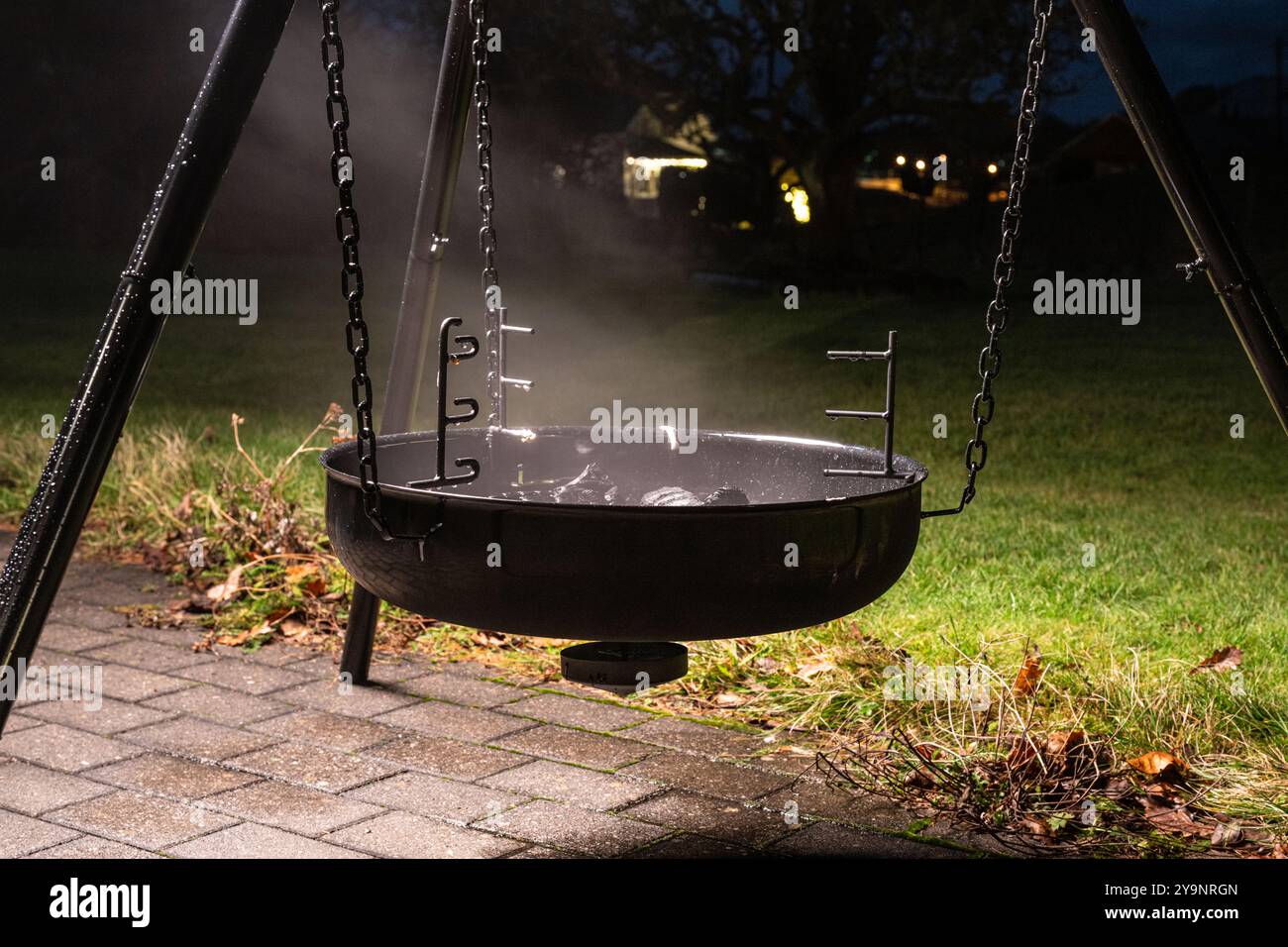 Smoke rising from a hanging fire pit Stock Photo - Alamy