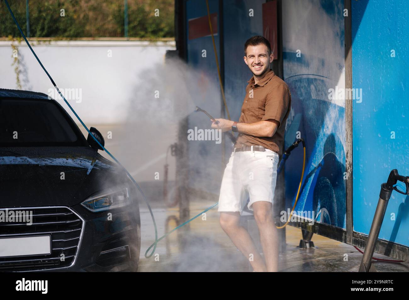 Young man uses high pressure hi-res stock photography and images - Alamy