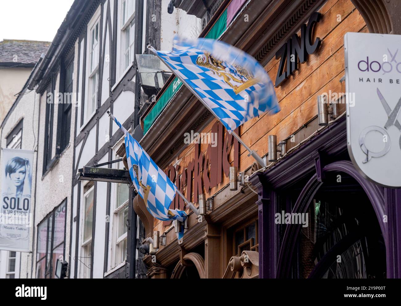 Bavarian flags flying outside a German Bierkellar - beer cellar bar in ...