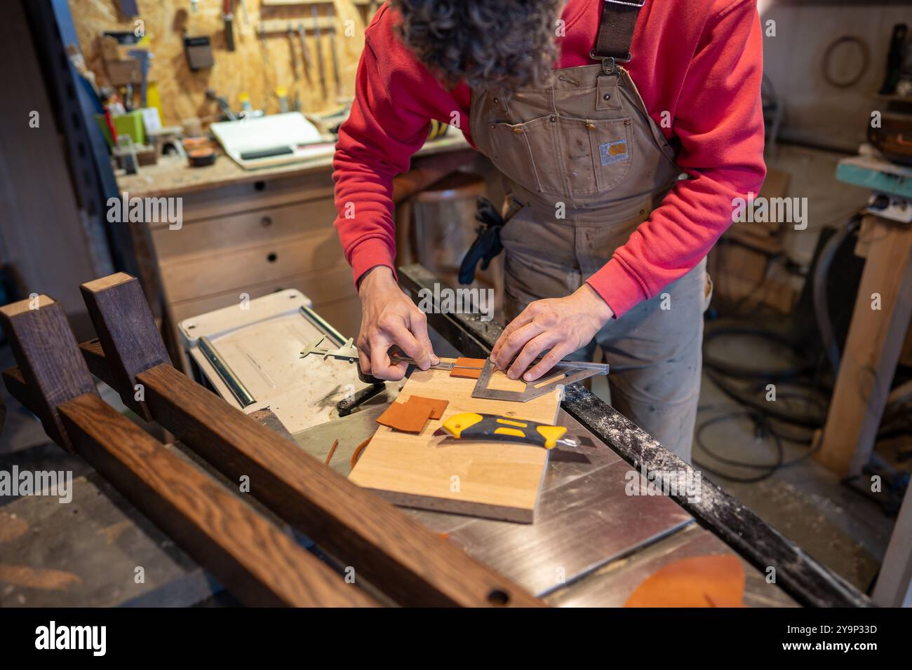 Carpenter work in furniture workshop, using ruler, caliper to cut ...