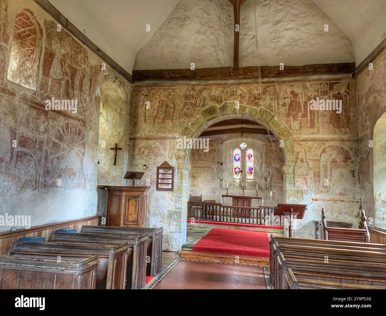 Interior of St Botolph’s church, Hardham, painted frescos on walls ...