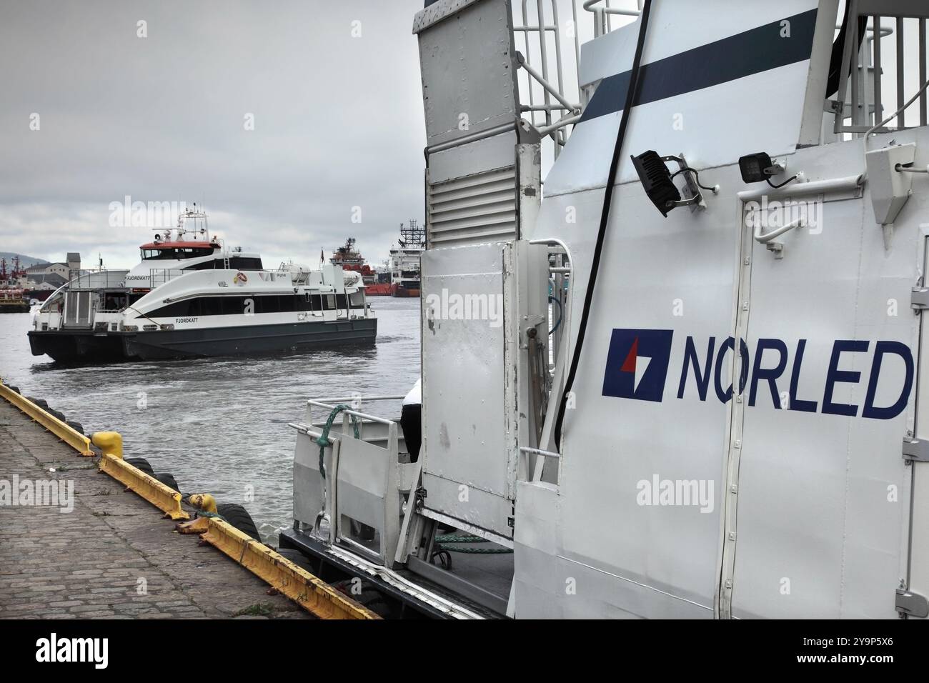 Catamaran ferry docking alongside the Norled ferry, Bergen, Norway ...