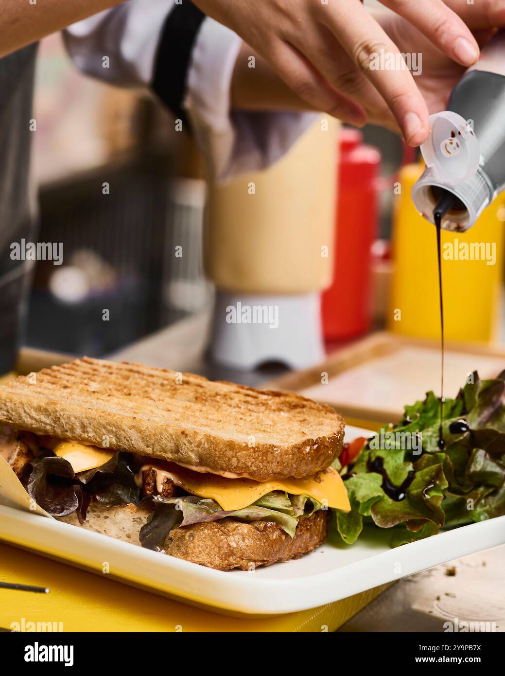 Woman making cheese sandwich hi-res stock photography and images - Alamy