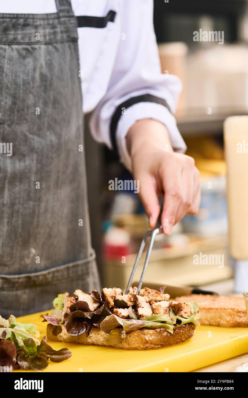 chef preparing chicken sandwich at kitchen in Bangkok Stock Photo - Alamy
