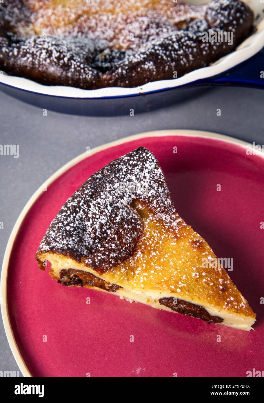 A Slice Of Fra Breton Custard Pie On A Red Plate Stock Photo - Alamy