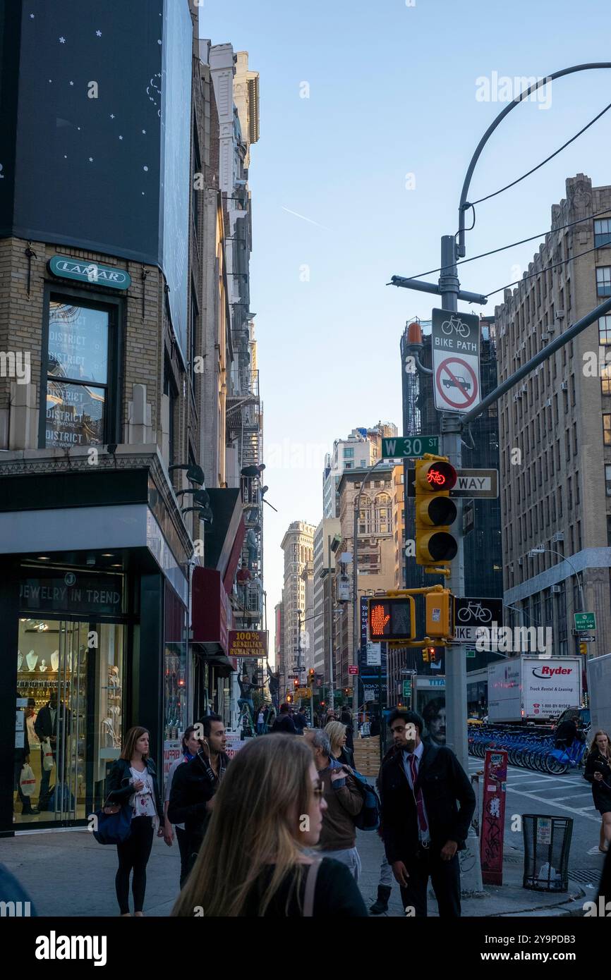 Crowded intersection in New York City street scene vertical Stock Photo ...