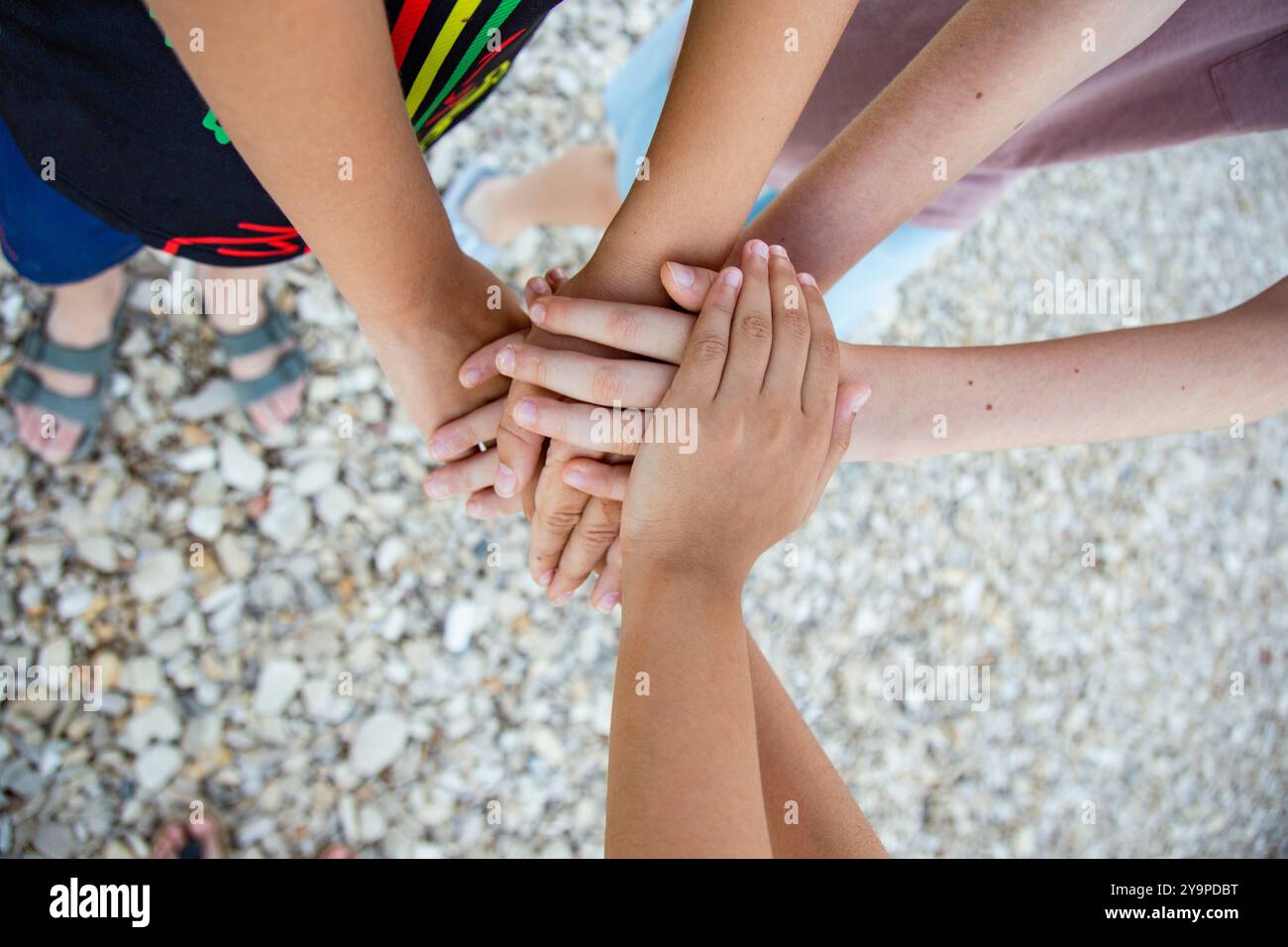 Close-up of friends hands stacking together teamwork and collaboration Stock Photo - Alamy