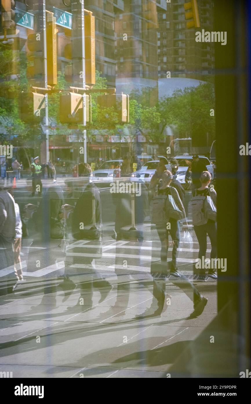 Multiple reflections in window New York City vertical Stock Photo - Alamy