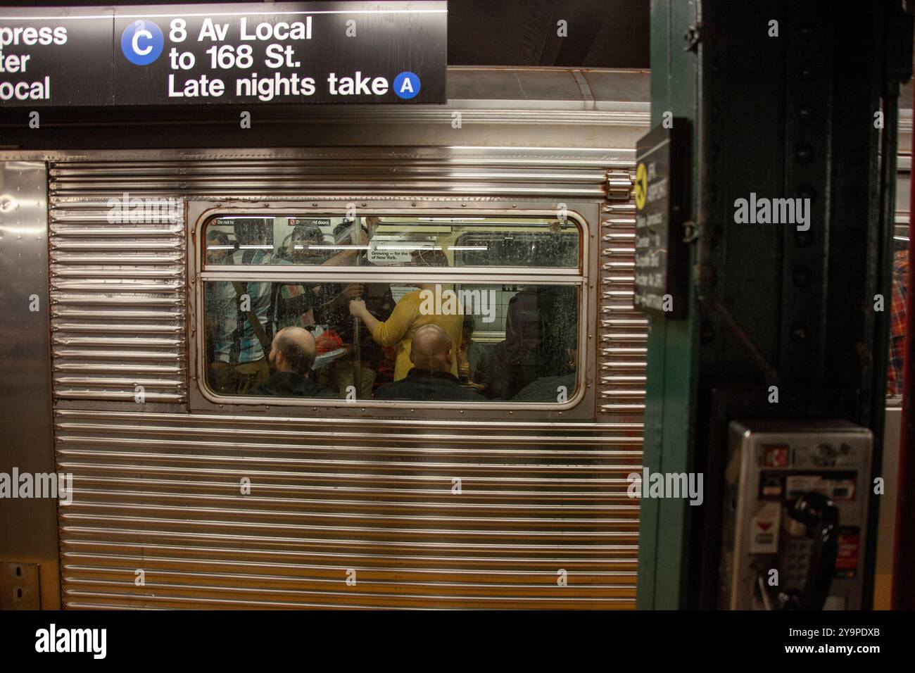New York subway train window with riders inside Stock Photo - Alamy