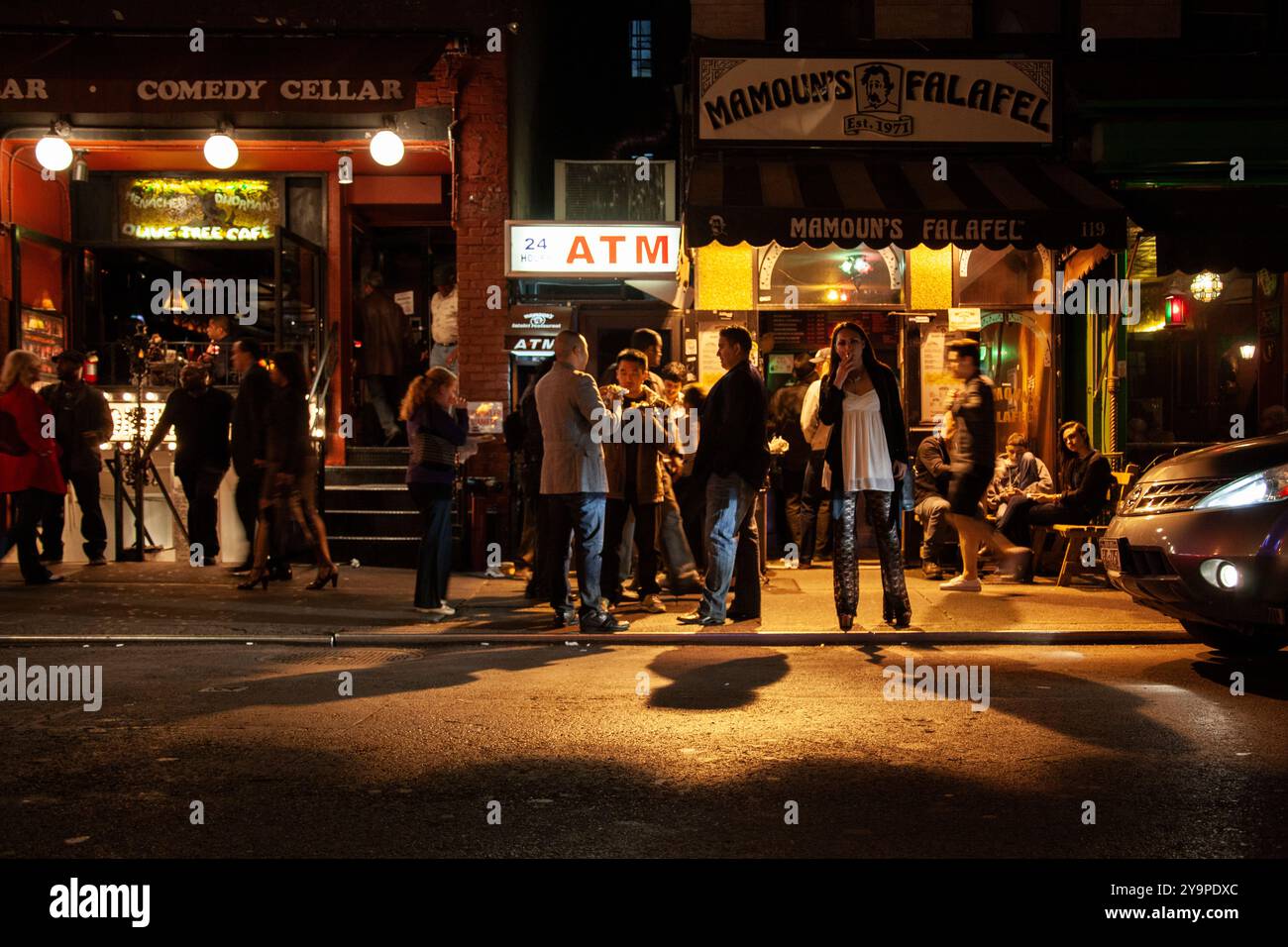 Crowds gathers on New York street at night Stock Photo - Alamy