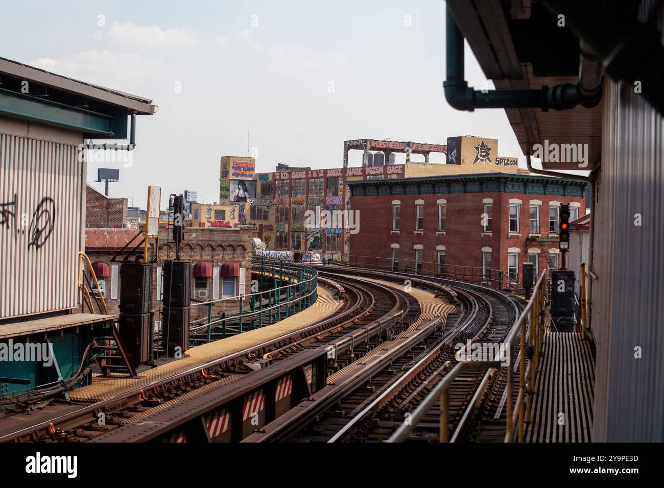 Subway train tracks curving through buildings in New York Stock Photo ...