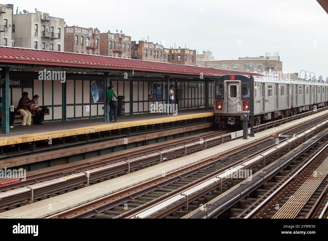 A subway train pulls up to platform in the Bronx New York Stock Photo ...