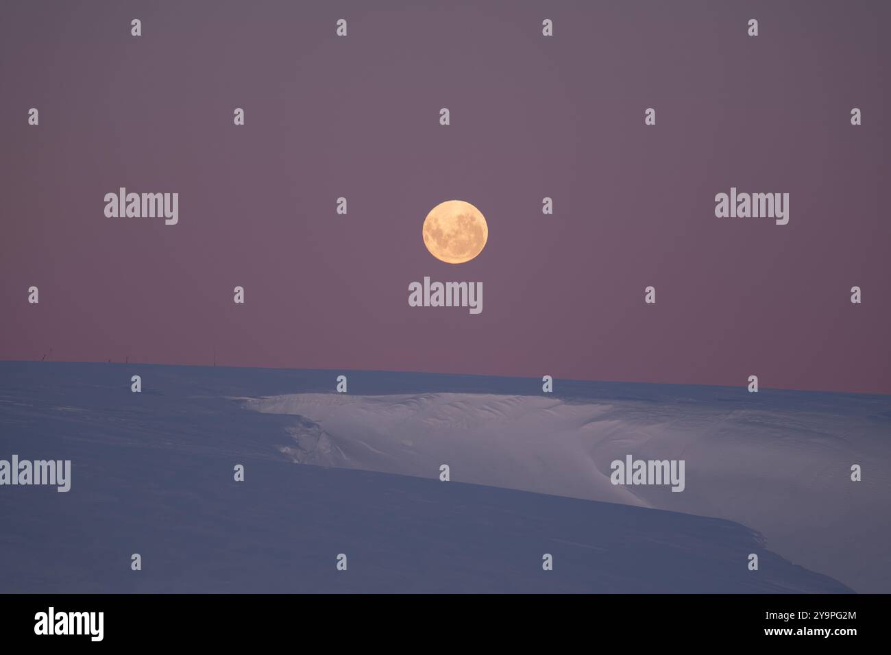 Full yellow moon in Antarctica. Night Stock Photo - Alamy