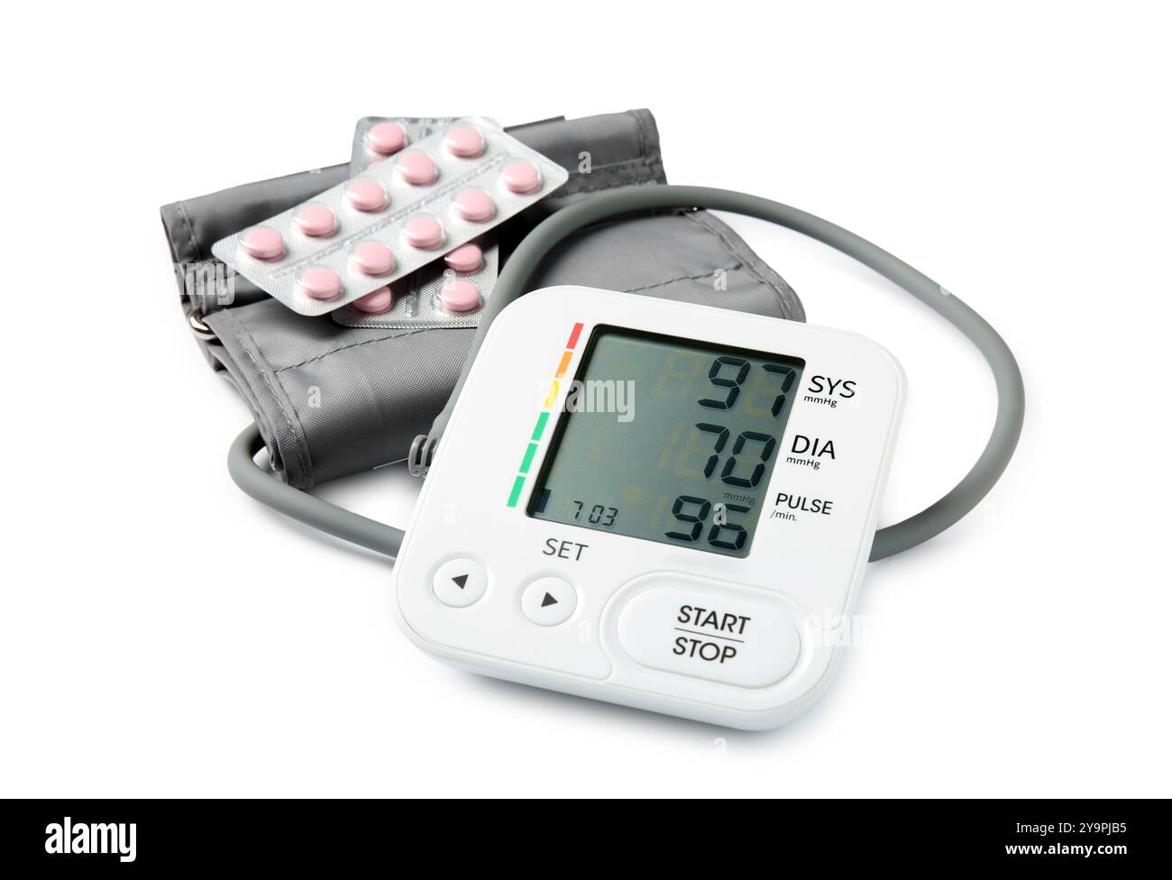 Blood pressure measuring device and pill blisters isolated on white ...