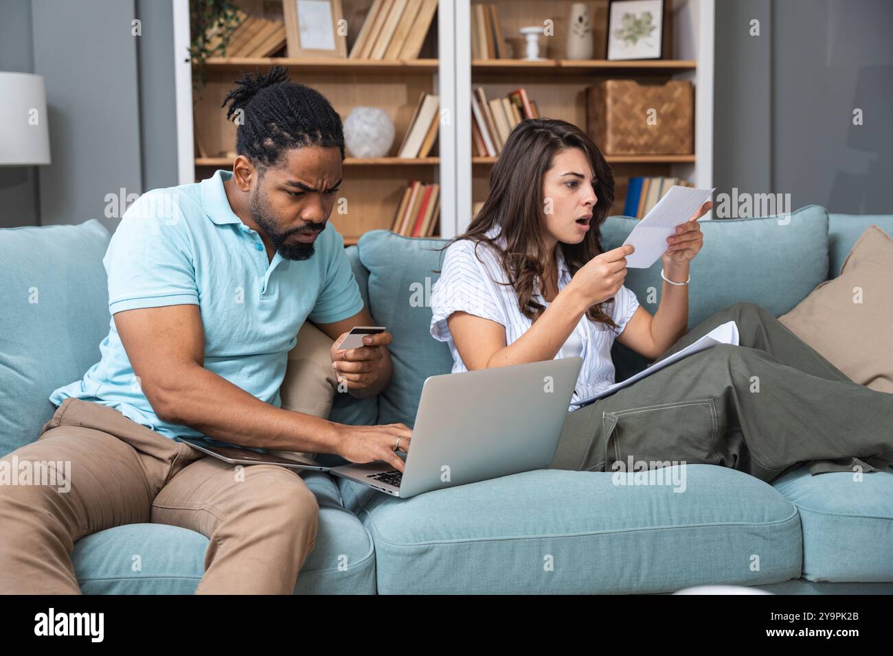 Home finance issues. Young couple having problem with utility bills ...