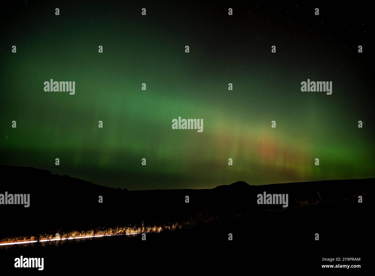 Northern lights, aurora borealis, displaying over Penyghent, one of the ...