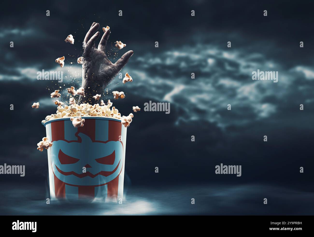 Scary zombie hand coming out of a popcorn bucket: horror movies and ...