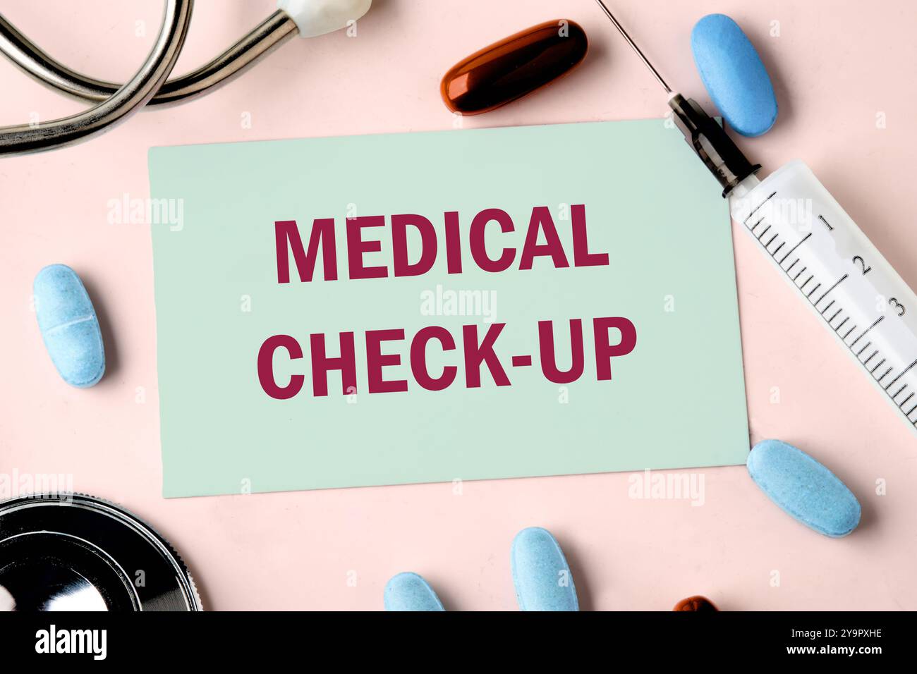 MEDICAL CHECK-UP words written on the business card, top view ...