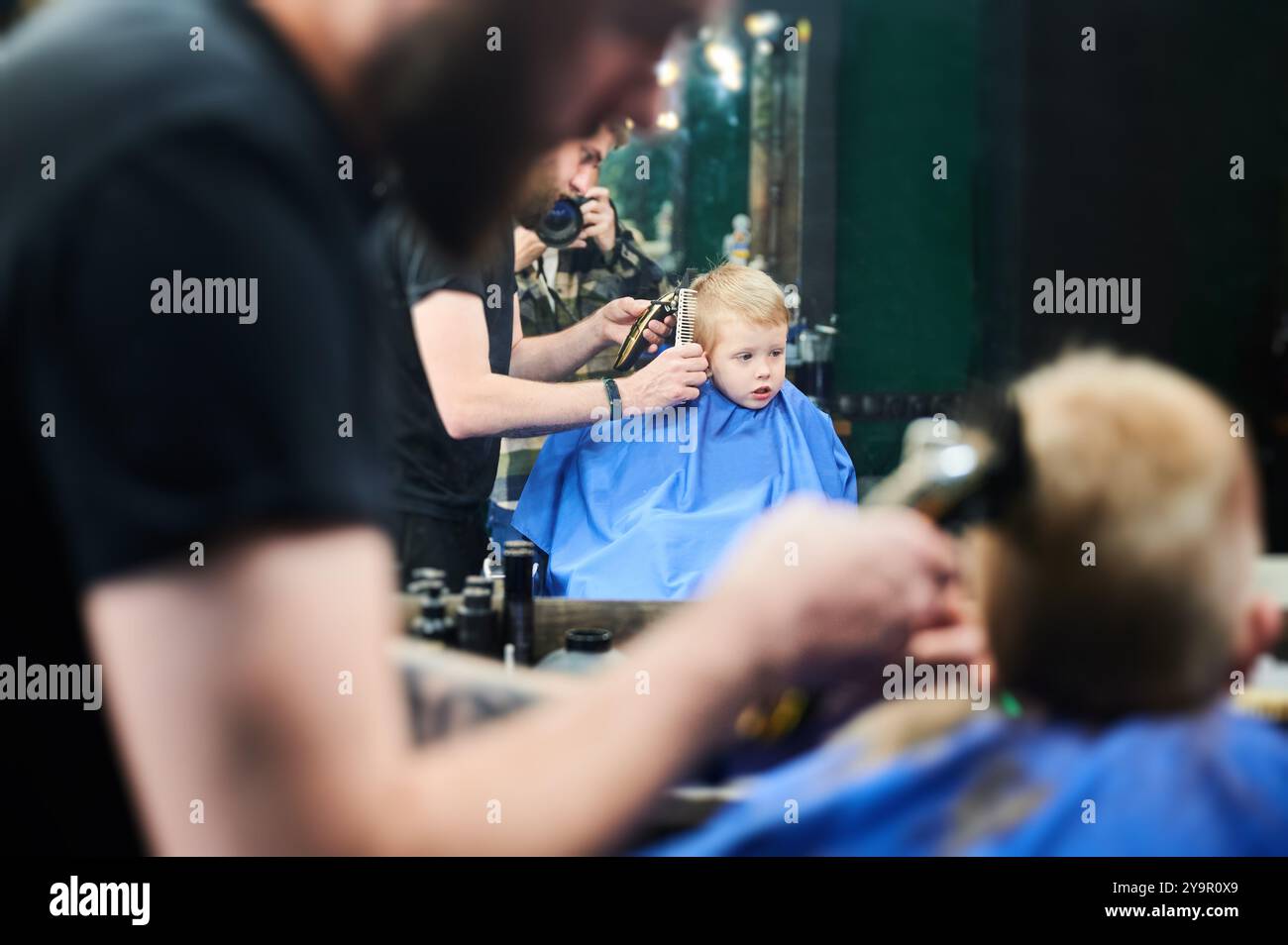 Cute boy worried about new haircut. Little client first time in ...