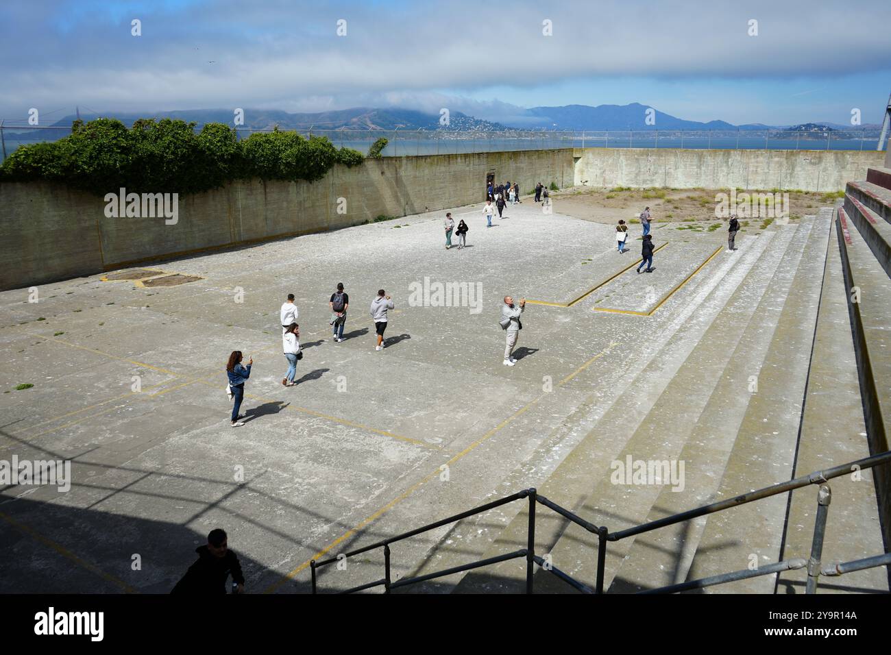 Tourists in the exercise yard at Alcatraz Prison Stock Photo - Alamy