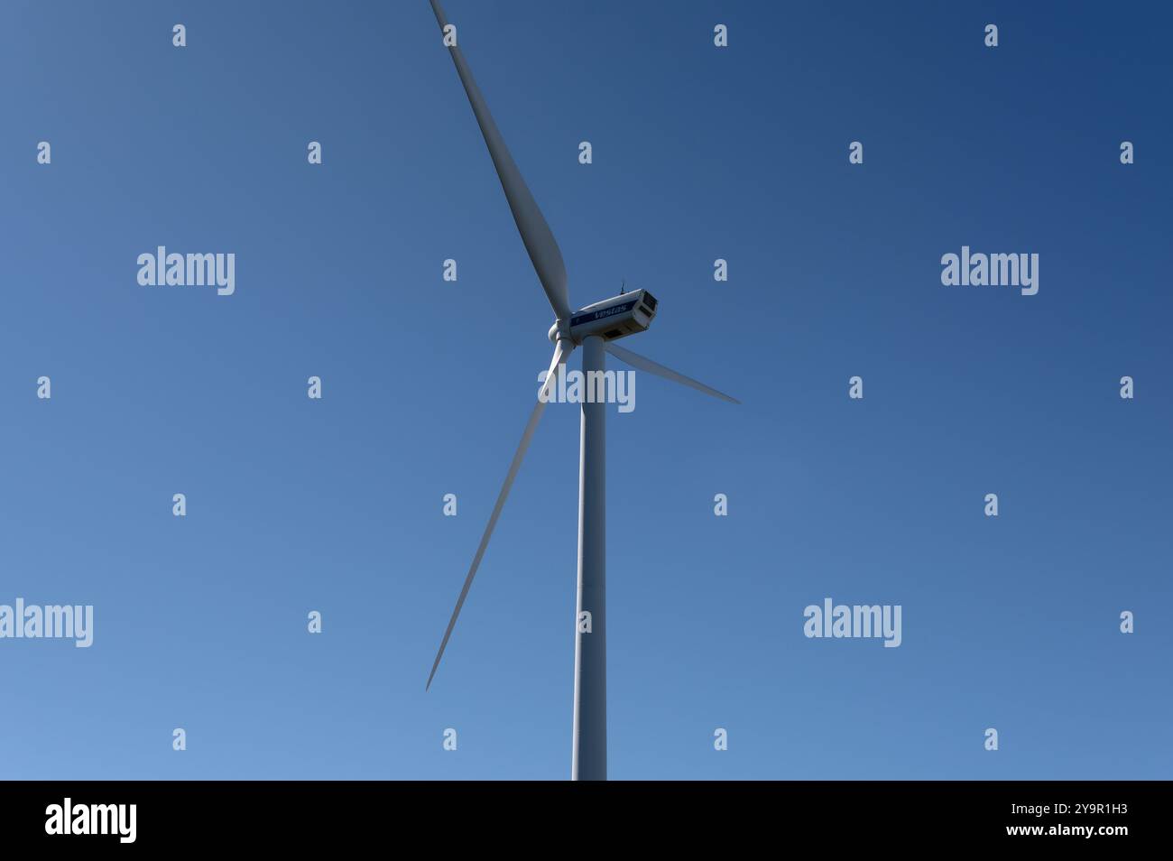 Wind turbine soaring under the clear Madeira sky, harnessing renewable energy Stock Photo - Alamy