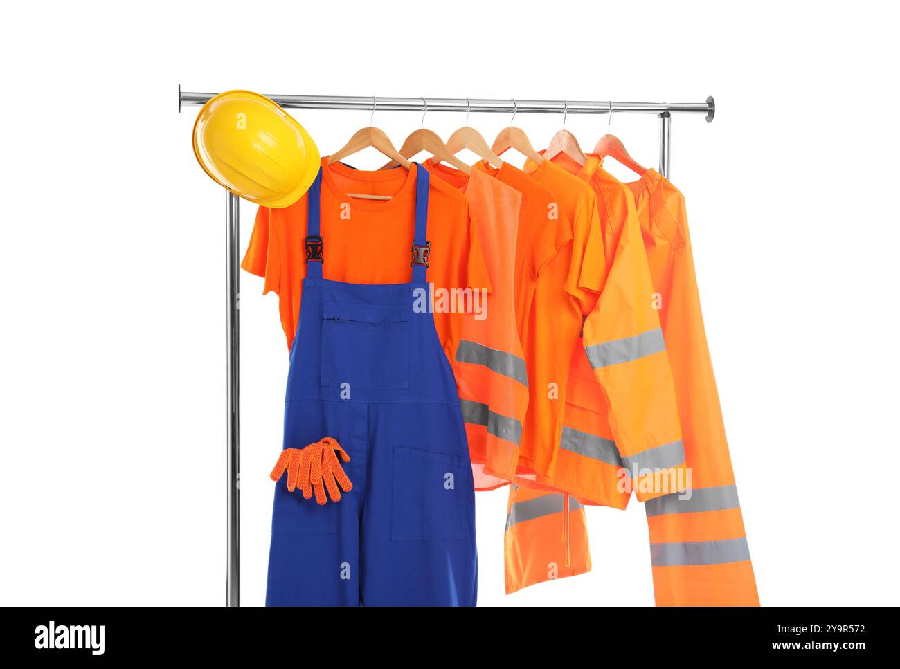 Workers' uniforms on clothing rack isolated on white Stock Photo - Alamy