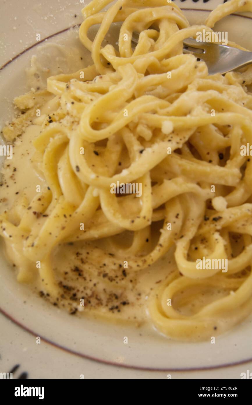 Tagliolini alla Romana cacio e pepe is a traditional Italian dish made ...