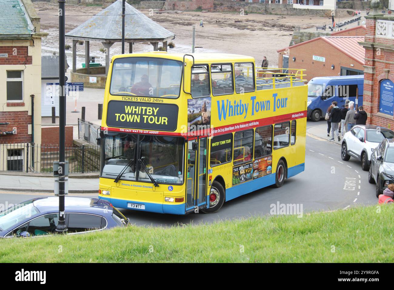 Whitby Town Tour Bus travelling through the centre of Whitby, England ...