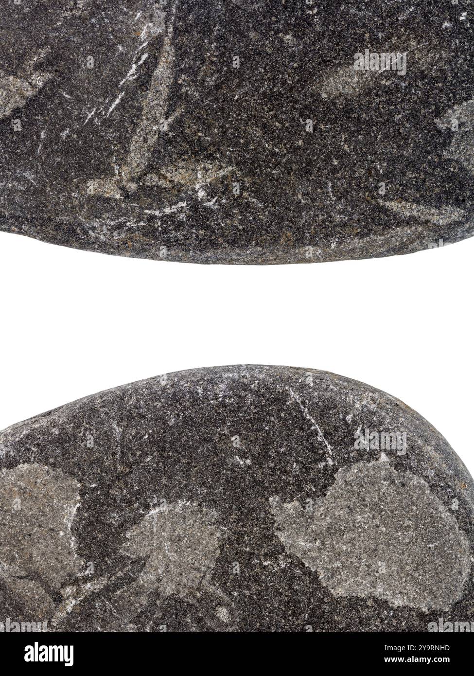 Edges of two pebbles isolated on white background with a space for text ...