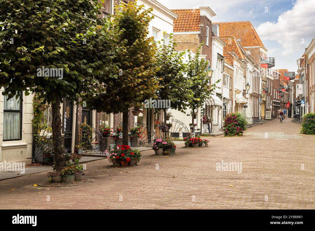 Cyclist in narrow street hi-res stock photography and images - Alamy