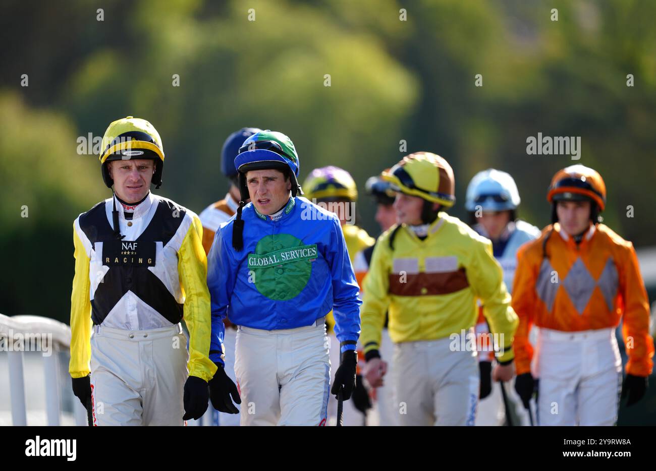 Jockey Harry Skelton (centre) leads out the jockeys make their way out ...