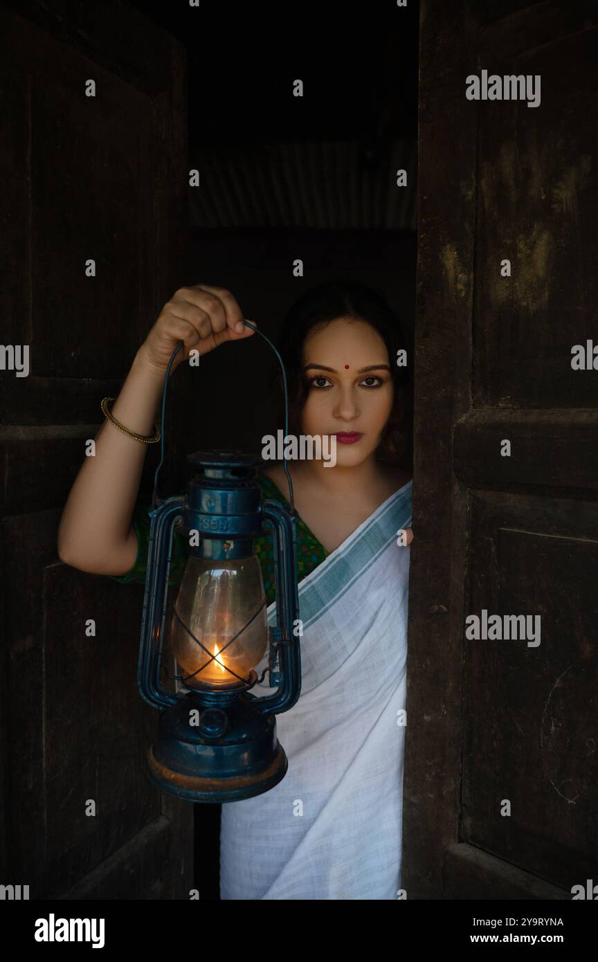 Emerging from the shadows, Carrying her own light Stock Photo - Alamy