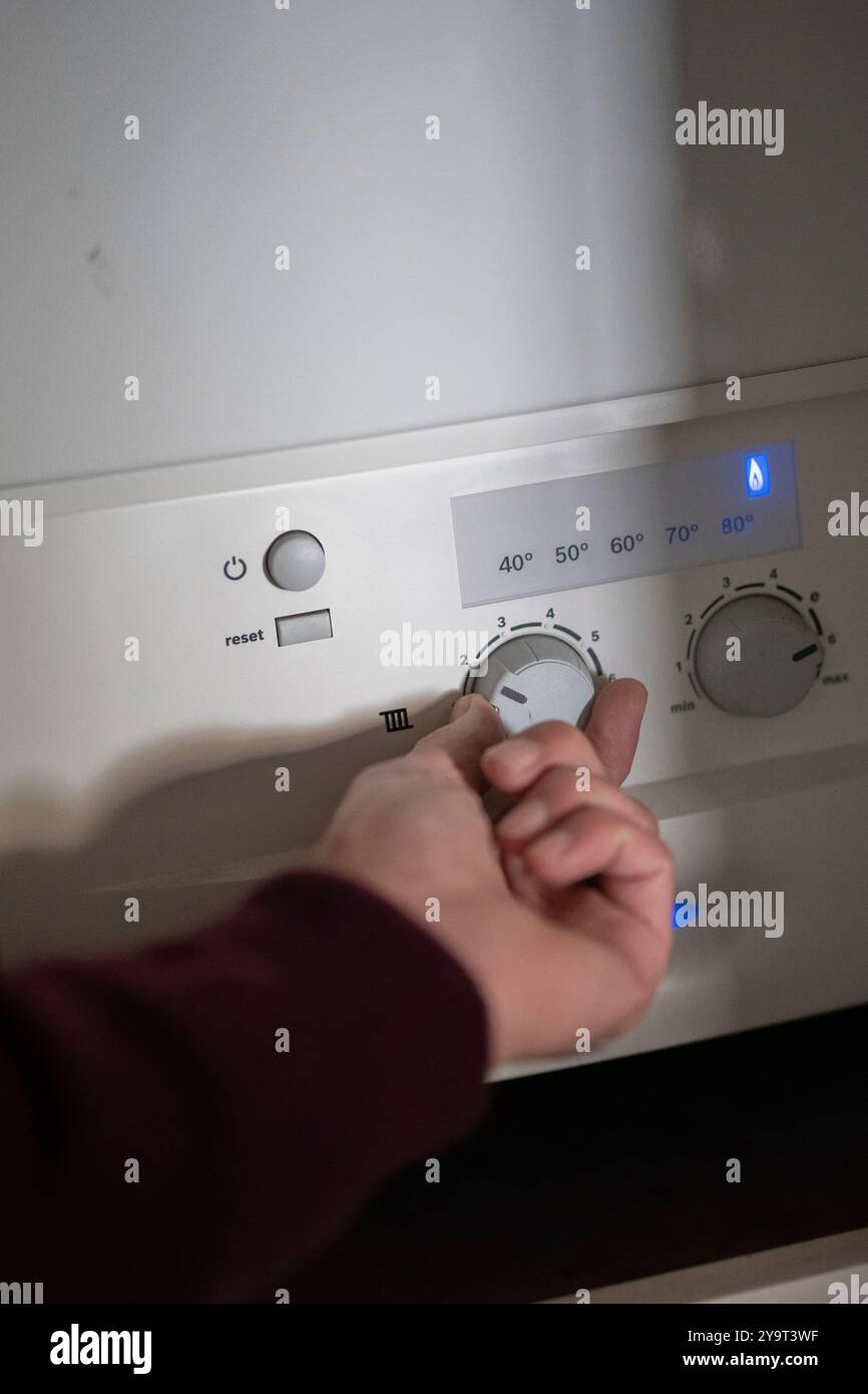 Energy illustration : This picture shows a man using an electric boiler ...